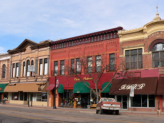 Historic brick buildings line Main Street in Cañon City, where Pizza Madness offers a slice of local flavor amid architecture that whispers tales of Colorado's past.