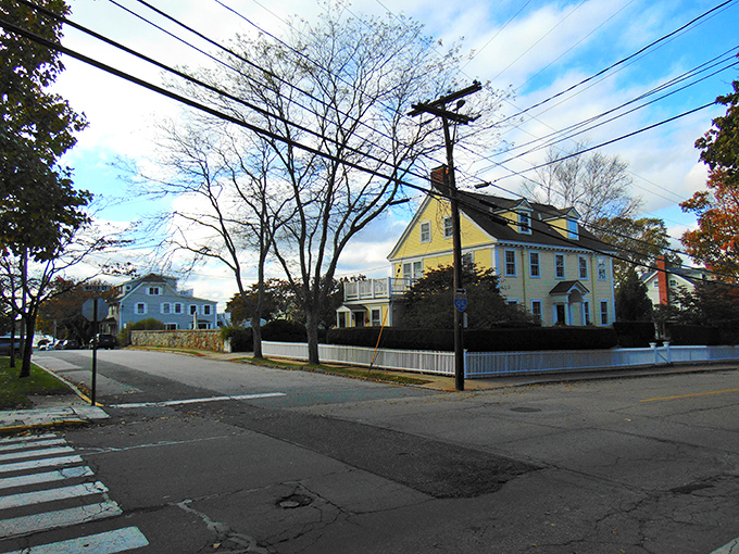 Colorful colonial homes line Stonington's streets like a New England rainbow – red, yellow, and white facades telling stories of maritime heritage.