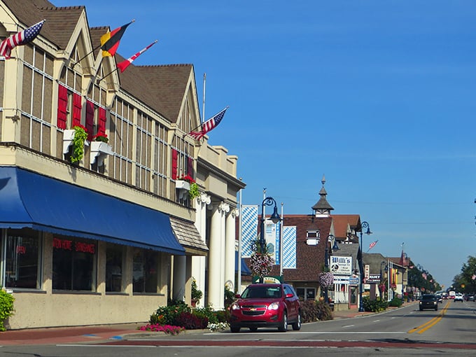 Main Street Frankenmuth looks like someone shrink-wrapped a Bavarian village and dropped it in the Michigan countryside. Those flags aren't just for show—they're waving "willkommen!"