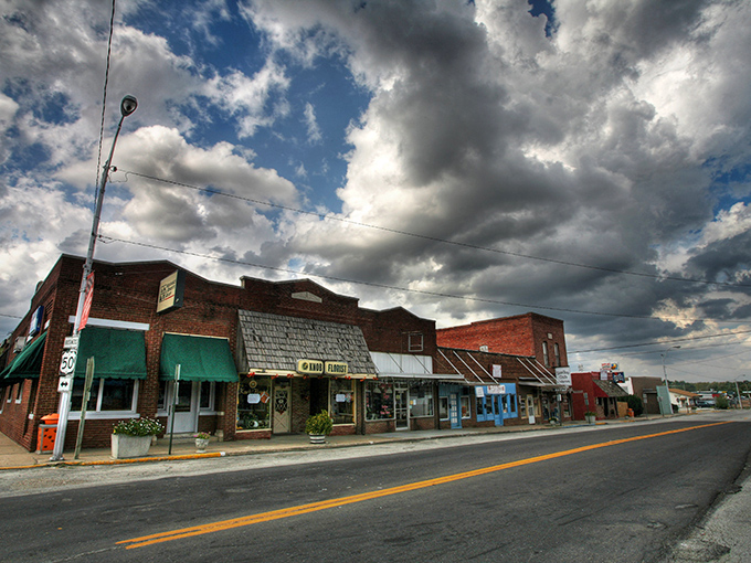 Highway signs point the way to Knob Noster – where your retirement dollars stretch further than your grandmother's homemade taffy at the county fair.