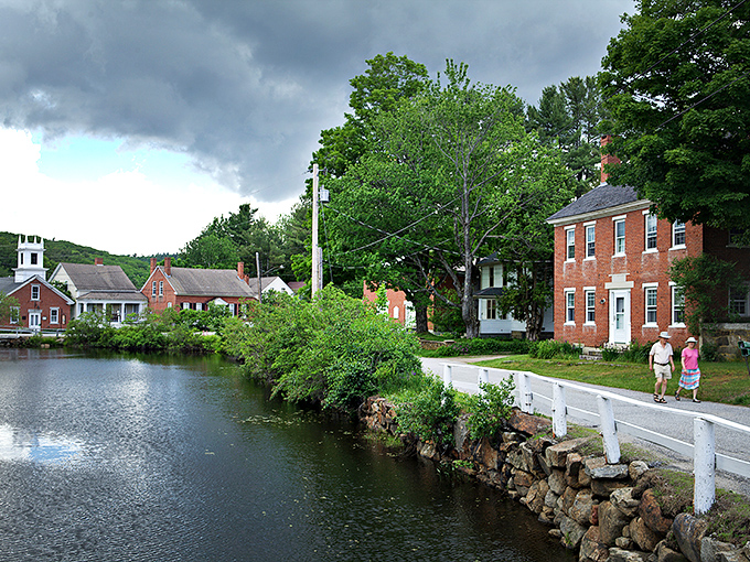 Storybook perfection isn't Photoshopped here—Harrisville's historic buildings embrace the millpond like old friends catching up after a long winter.