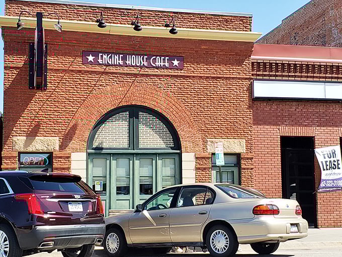 The iconic brick facade of Engine House Cafe stands as a delicious monument to adaptive reuse. Those green doors once welcomed fire trucks; now they usher in hungry Nebraskans.