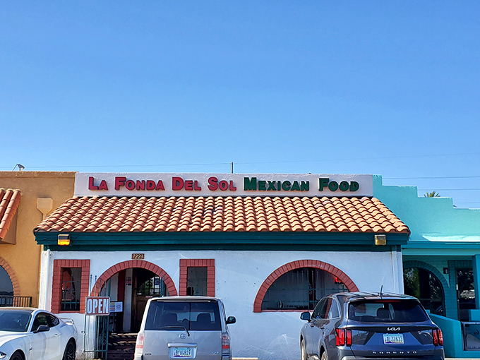 The classic white stucco, red brick arches, and clay tile roof aren't just Southwestern charm—they're a beacon calling hungry travelers from across Arizona.