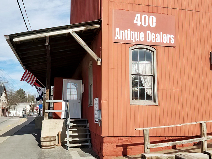 The brilliant vermilion exterior of Roller Mills Marketplace isn't just eye-catching—it's practically screaming "treasure inside!" like a four-story siren call to antique lovers.