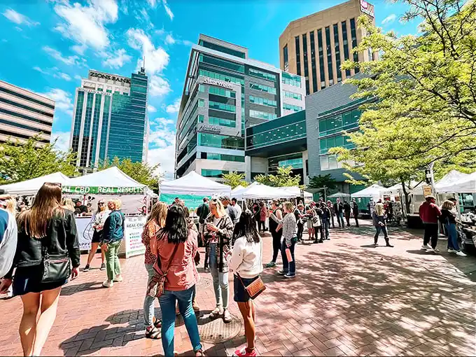 Downtown Boise transforms into a vibrant community tapestry every Saturday, where white tents line the streets and strangers become friends over shared discoveries.