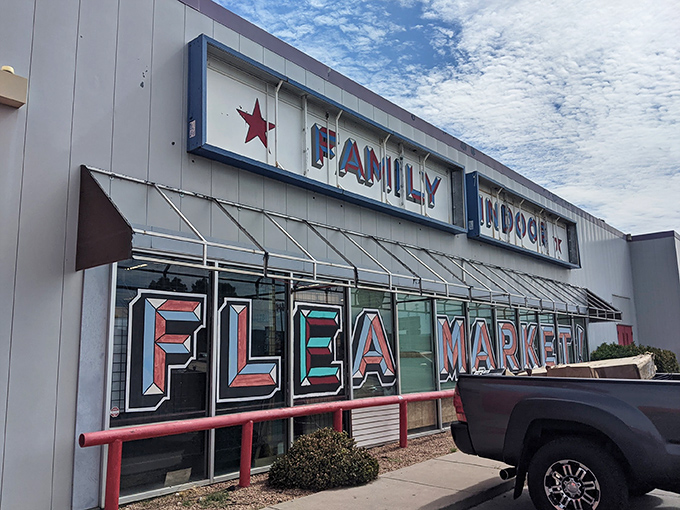 The red and white façade of Family Indoor Flea Market stands like a beacon for treasure hunters. Bargain paradise awaits behind those doors!