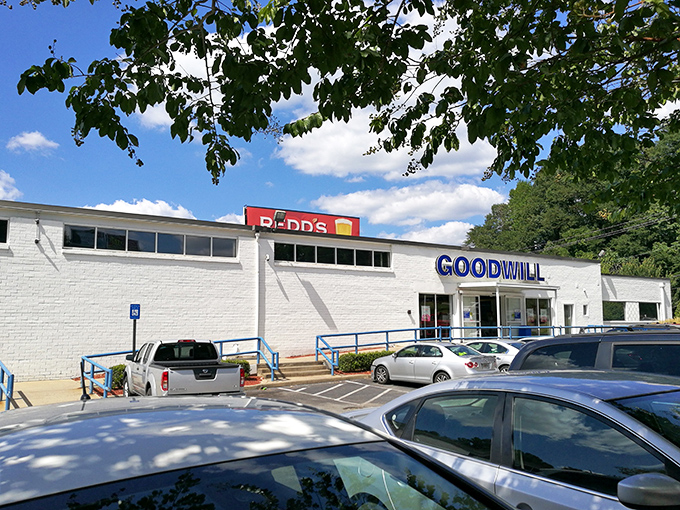 The unassuming white building with bold blue lettering promises treasure hunting adventures that fancy boutiques simply can't match.
