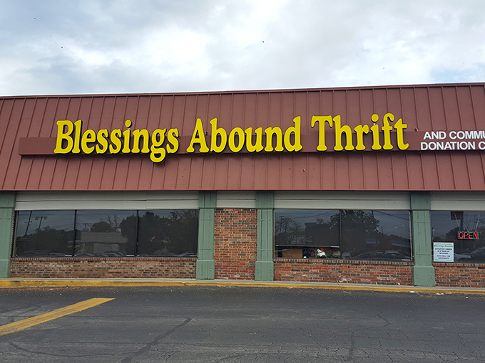 The bright yellow sign beckons like a budget-friendly lighthouse, guiding bargain hunters to shores of affordable treasures in Overland Park.