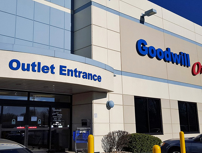 The yellow facade of Kansas City's Goodwill Outlet gleams like a beacon for bargain hunters under the clear Missouri sky.