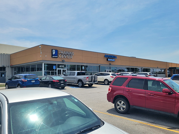 The unassuming beige exterior of the Goodwill Outlet belies the treasure-hunting paradise within—like finding a secret portal to bargain heaven in suburban Omaha.