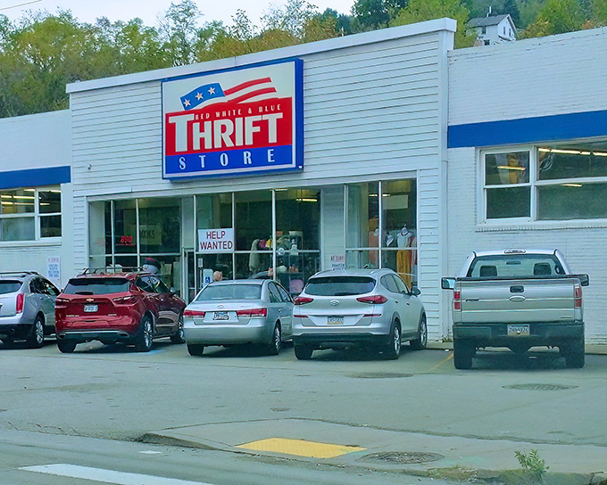 The patriotic facade of Red White And Blue Thrift Store beckons bargain hunters like a siren song for the fiscally responsible.