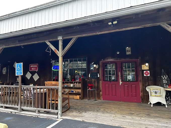 The unassuming exterior of Antique City Mall beckons with its rustic charm and iconic red door – Florida's time machine disguised as a country store.