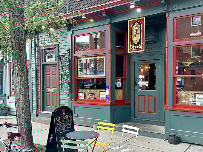 The emerald facade with cherry-red trim isn't just eye-catching—it's a promise that inside this unassuming Cambridge corner, culinary magic awaits.