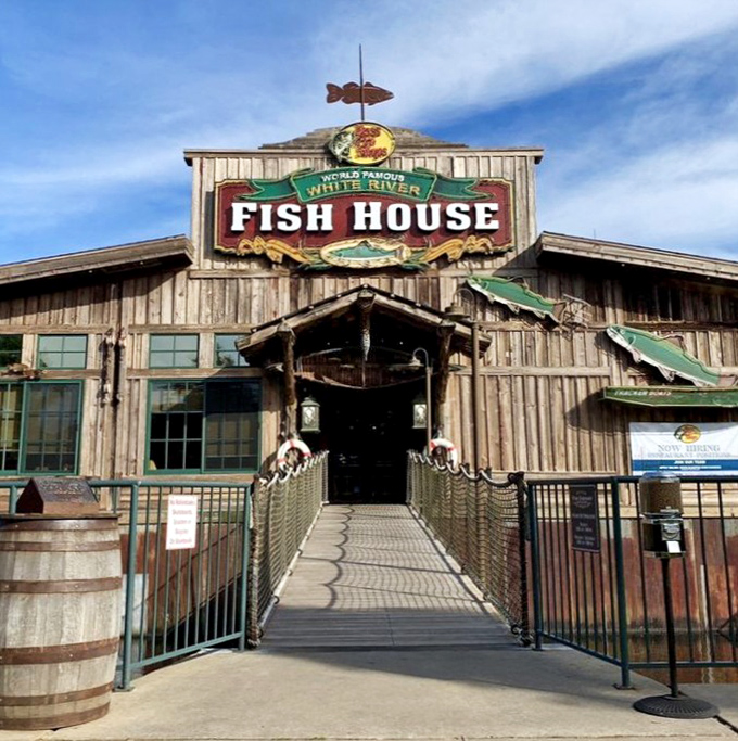 The rustic wooden exterior of White River Fish House beckons like an old friend, complete with that fish-shaped weather vane that seems to say "good catch inside!"