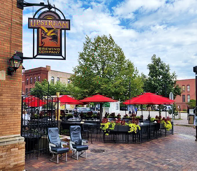 The historic brick façade of Upstream Brewing Company welcomes you to Omaha's Old Market district, where culinary magic awaits behind those wooden doors.