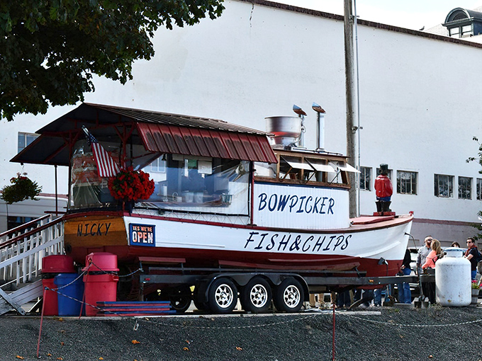 The legendary Bowpicker stands proudly on land, a fishing vessel that found its true calling serving up Astoria's most coveted seafood treasure.