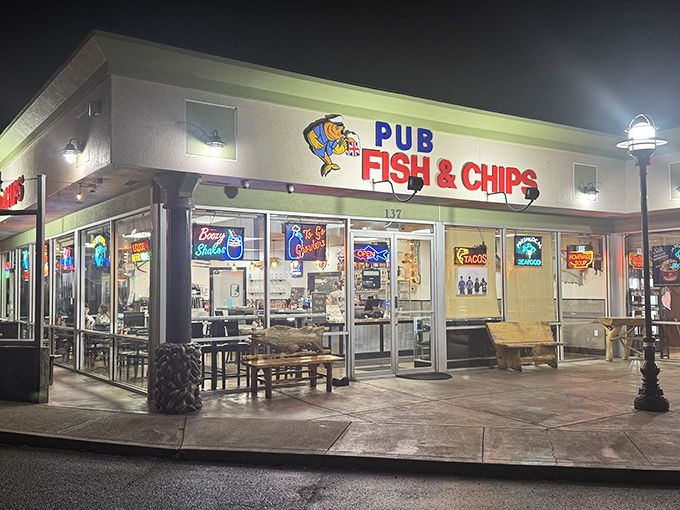The unassuming exterior of Pub Fish & Chips hides culinary treasures within. That blue marlin sculpture? Consider it your first clue to seafood excellence.