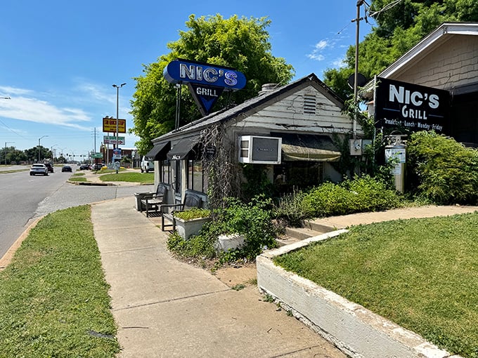 The humble exterior of Nic's Grill belies the culinary treasures within. This unassuming shack houses Oklahoma City's burger paradise.