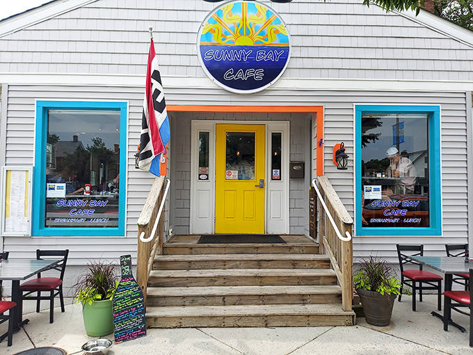 That bright yellow door isn't just welcoming visitors – it's practically begging you to come discover breakfast magic.