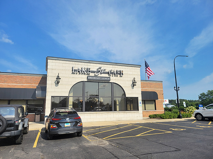 An unassuming strip mall storefront that proves culinary treasures don't always hide in fancy buildings. The American flag stands guard over breakfast paradise.