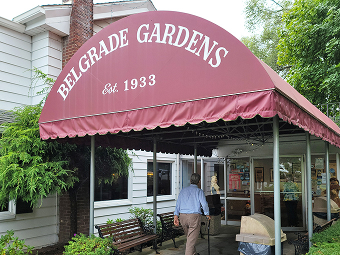 The iconic burgundy awning welcomes hungry pilgrims to Belgrade Gardens, where Barberton's fried chicken legacy has been sizzling since 1933.