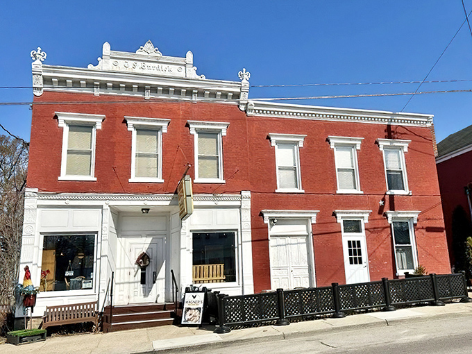 The stately red brick exterior of Wagner's Village Inn stands as a beacon of culinary tradition in Oldenburg, complete with a welcoming rooster sentinel.