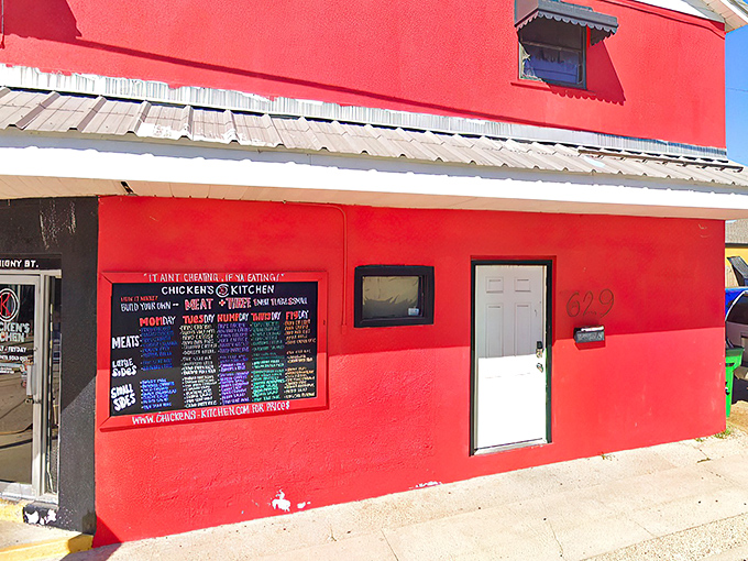 The red and white exterior of Chicken's Kitchen stands like a culinary lighthouse on Derbigny Street, beckoning hungry souls with promises of crispy perfection.