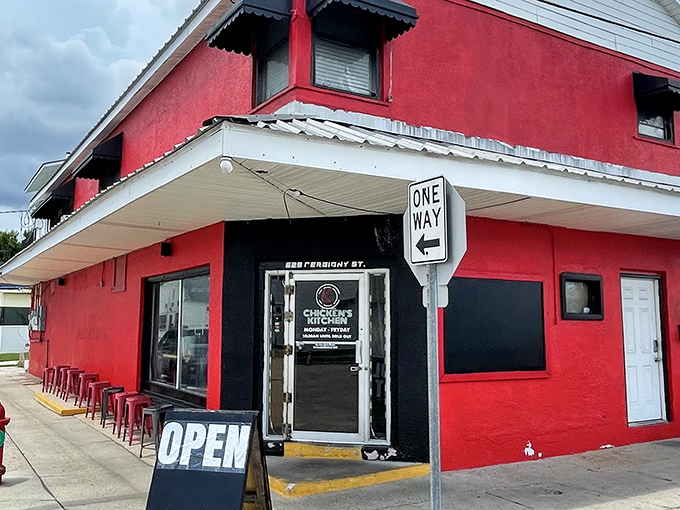 The red and white exterior of Chicken's Kitchen stands like a culinary lighthouse on Derbigny Street, beckoning hungry souls with promises of crispy perfection.