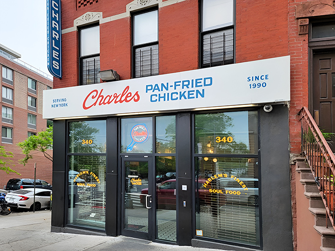 The storefront beckons like a lighthouse for hungry souls, its classic red and blue signage promising salvation from mediocre chicken since 1990.