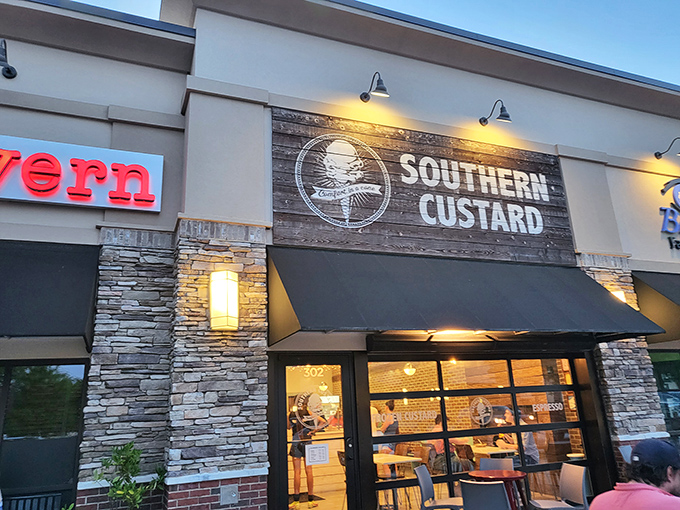 Southern Custard's storefront beckons with its sleek black awning and stone accents. The crowd outside tells you everything you need to know—this place is worth the wait.