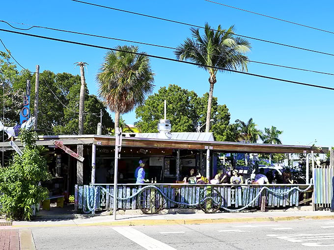 The ultimate Florida Keys contradiction: a ramshackle exterior that houses culinary treasures. Palm trees and power lines frame this beloved Key West institution.