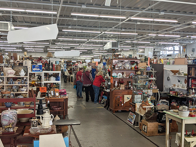 Treasure hunters navigate the maze-like aisles of antique booths, where yesterday's ordinary becomes today's extraordinary find. Every turn reveals new possibilities.