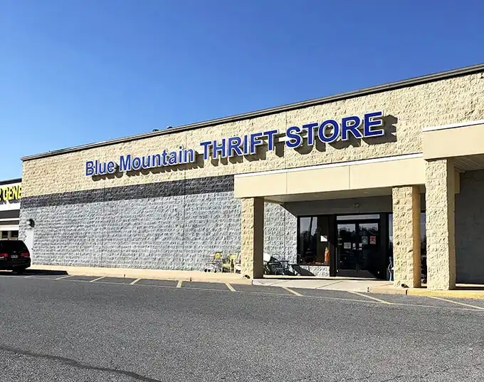 The unassuming exterior of Blue Mountain Thrift Store in Palmyra hides a treasure trove within. Like finding a five-star restaurant in a strip mall, the real magic happens once you step inside.