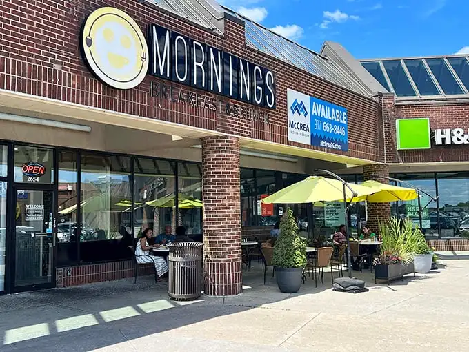 The cheerful yellow smiley face logo seems to know something you don't yet—that breakfast nirvana awaits behind those brick walls.