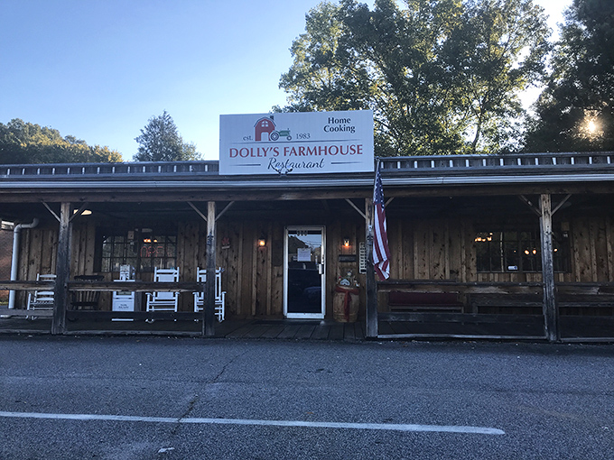 The rustic wooden exterior of Dolly's Farmhouse Restaurant promises authenticity before you even step inside. That American flag isn't just decoration—it's a guarantee.