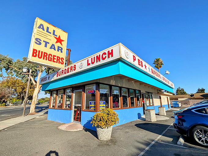 That turquoise trim isn't just eye-catching—it's a beacon of burger hope on the Newark horizon. The vintage sign promises simple pleasures done right.