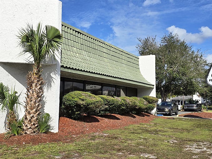 The unassuming exterior of Clock Restaurant in Gainesville hides a treasure trove of breakfast delights. Florida's palm trees stand guard outside this local institution.