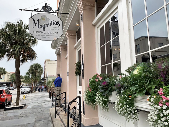 Magnolias' pink façade stands like Charleston's culinary equivalent of a Southern belle—graceful, inviting, and hiding delicious secrets behind those elegant windows.