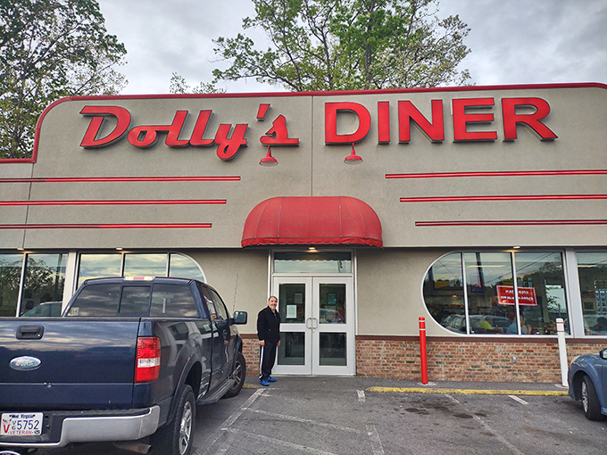 The classic red signage of Dolly's Diner beckons like a lighthouse for the breakfast-starved. This retro exterior promises comfort food without pretension.