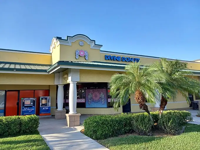 The cheerful yellow facade of Divine Donuts stands out like a sugary beacon in Fort Myers, promising sweet salvation for donut enthusiasts.