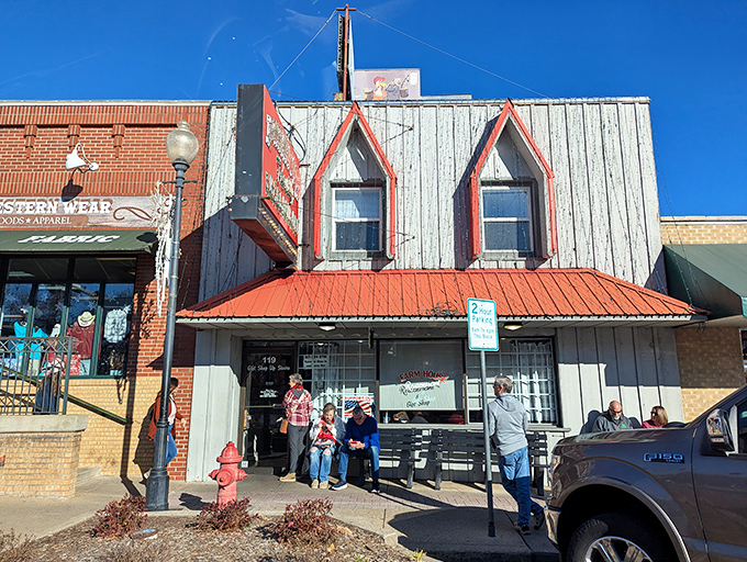 The unassuming storefront with its red-trimmed dormer windows might not scream "culinary destination," but the best comfort food often hides in plain sight.