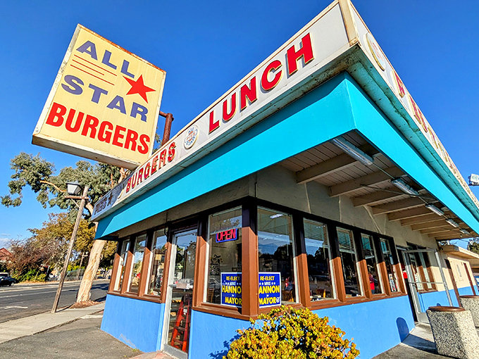 That turquoise trim isn't just eye-catching—it's a beacon of burger hope on the Newark horizon. The vintage sign promises simple pleasures done right.