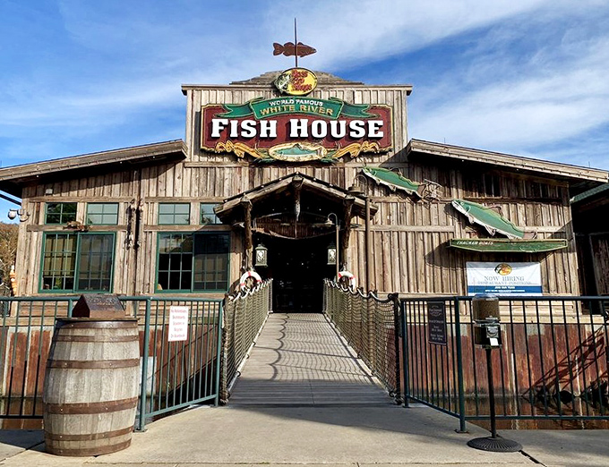The rustic wooden exterior of White River Fish House beckons like an old friend, complete with that fish-shaped weather vane that seems to say "good catch inside!"