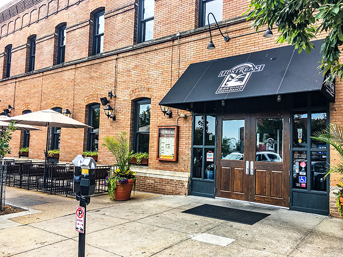 The historic brick façade of Upstream Brewing Company welcomes you to Omaha's Old Market district, where culinary magic awaits behind those wooden doors.