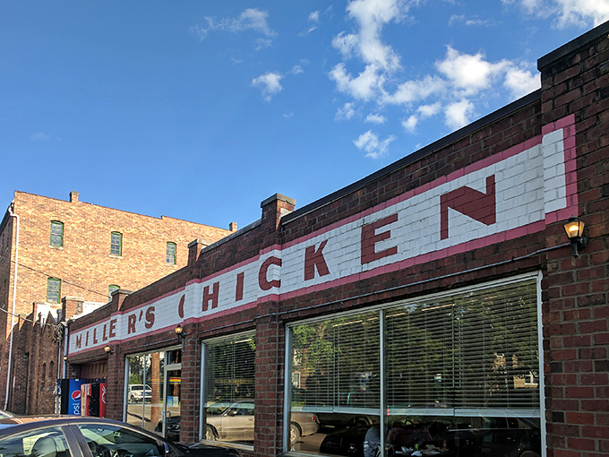 The iconic brick façade of Miller's Chicken stands as Athens' monument to comfort food, complete with seasonal poinsettias that say "we care about the details."