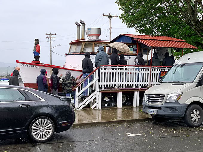 The legendary Bowpicker stands proudly on land, a fishing vessel that found its true calling serving up Astoria's most coveted seafood treasure.