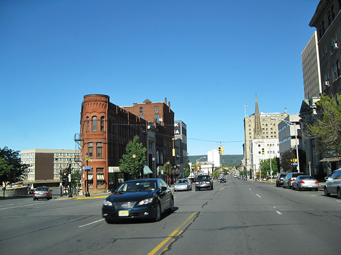 Utica's farmers market brings the community together under historic industrial architecture, where local produce meets global flavors in a vibrant weekend ritual. 