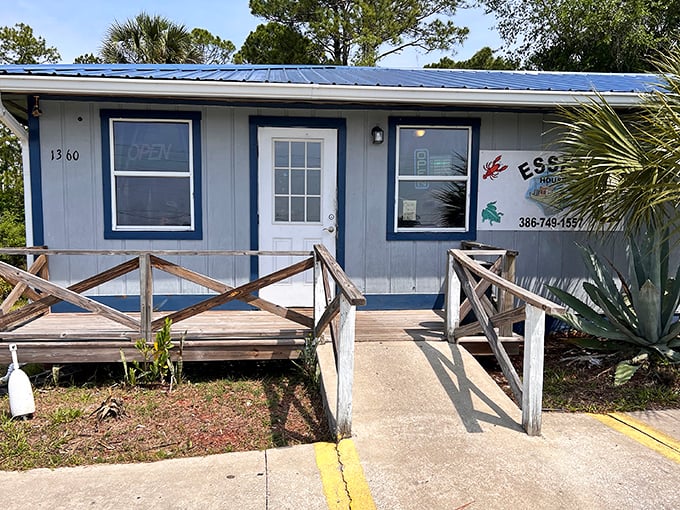 The blue-roofed beacon of seafood salvation sits unassumingly in Pierson, promising "Famous Fried Clams" that have seafood pilgrims filling the parking lot daily.