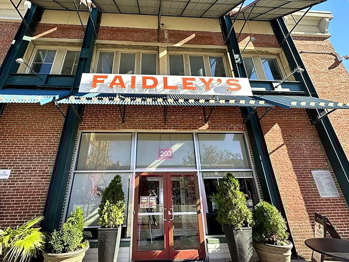 The brick facade and iconic blue awning of Faidley's stands like a seafood beacon in Baltimore, promising treasures of the Chesapeake within.