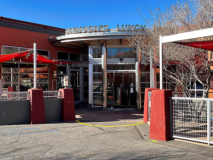 The iconic red exterior of Range Cafe beckons hungry travelers with its bold "BREAKFAST LUNCH DINNER" promise—a siren song for comfort food enthusiasts.